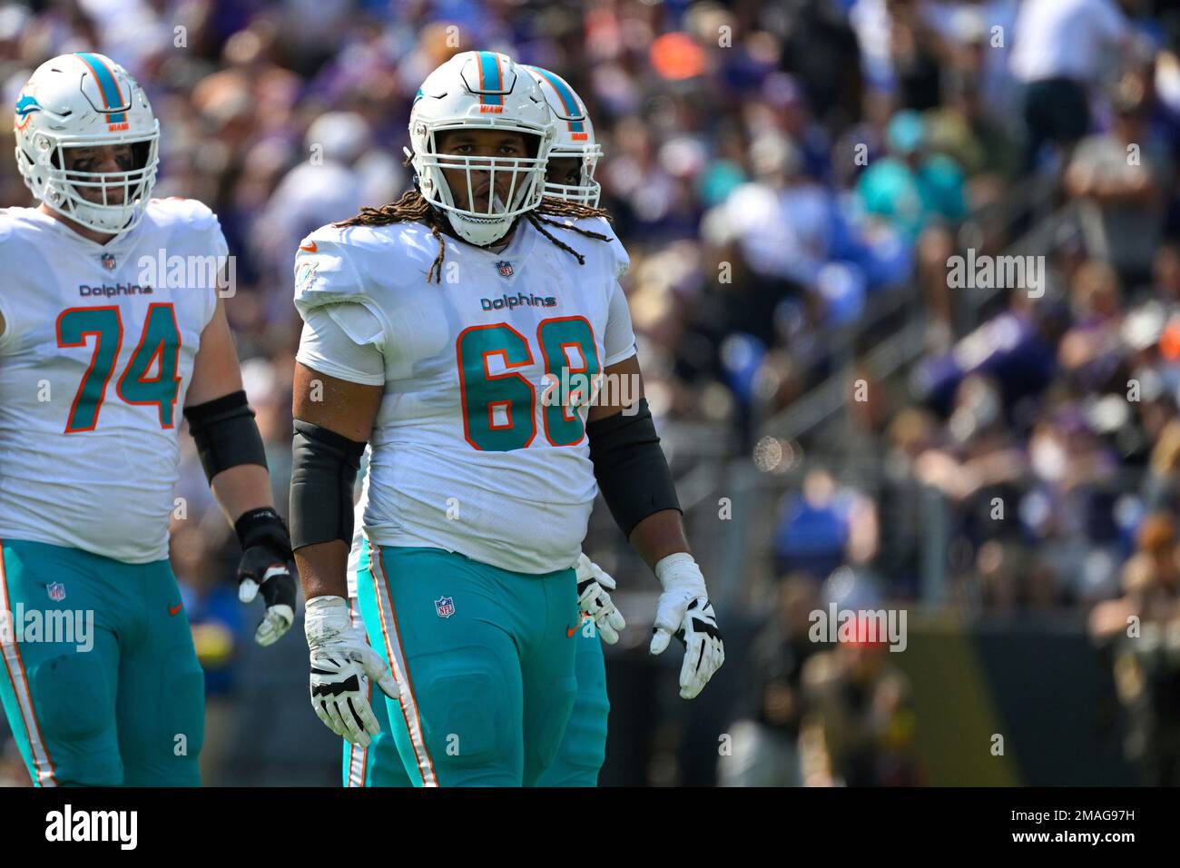 Miami Dolphins offensive tackle Robert Hunt (68) looks on between plays ...