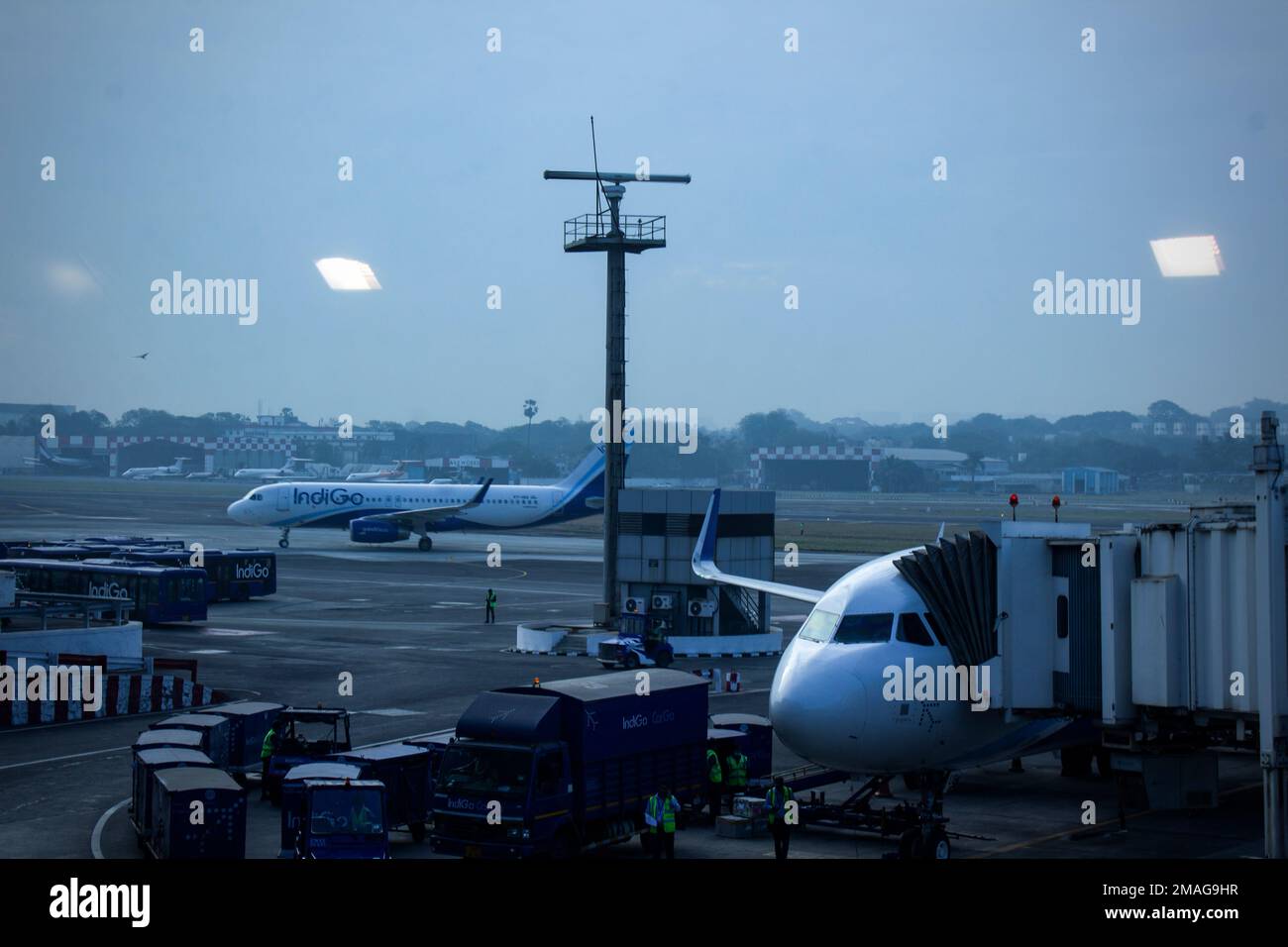 Indian aircraft landed in a busy airport terminal engine wings close ...