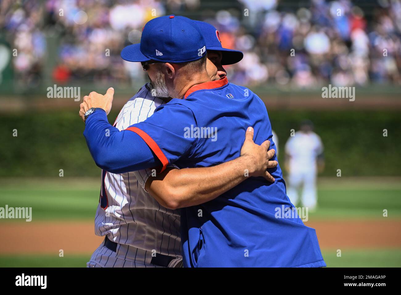 Chicago Cubs manager David Ross (right) hugs Willson Contreras after ...