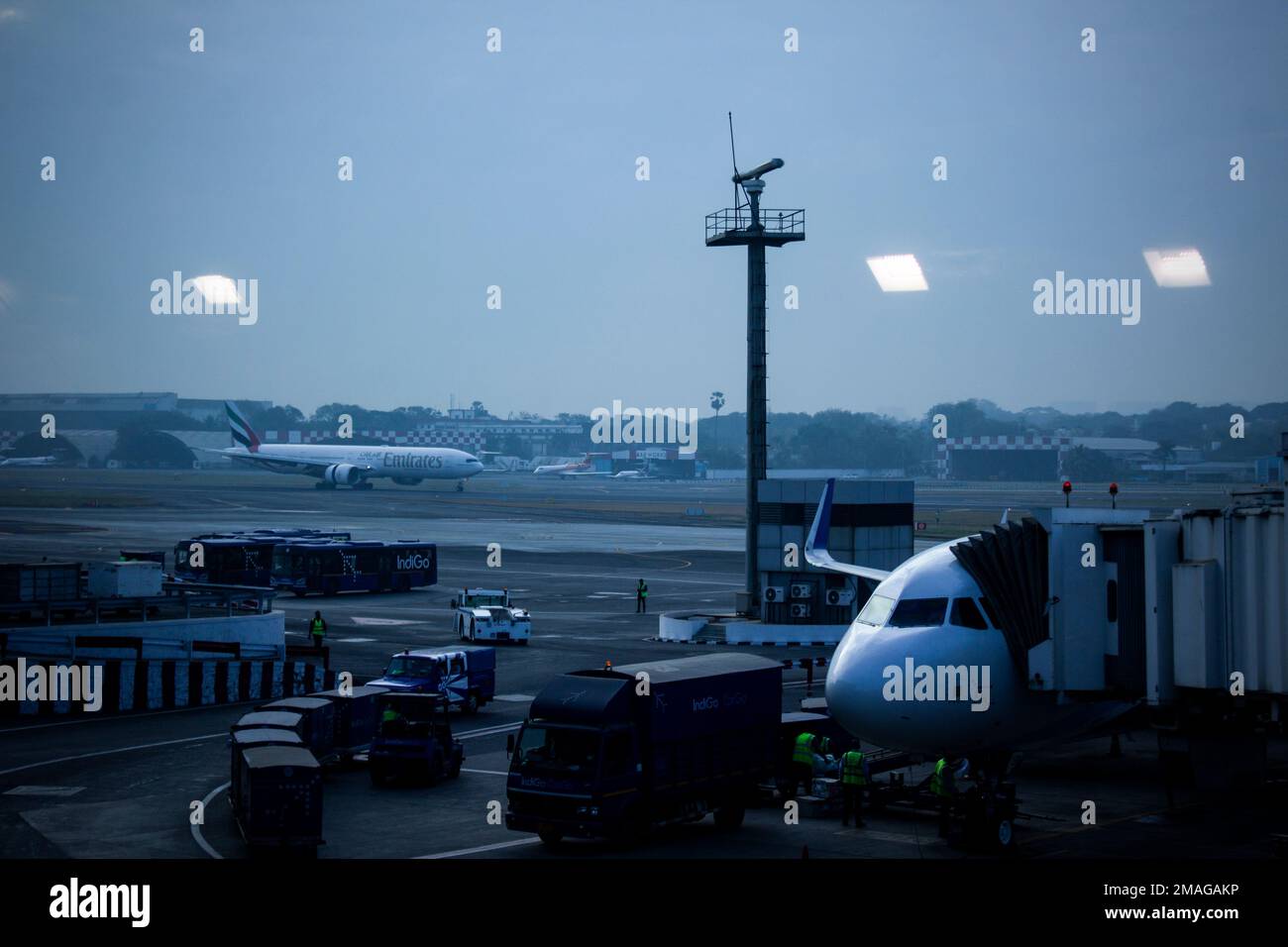 Indian aircraft landed in a busy airport terminal engine wings close ...