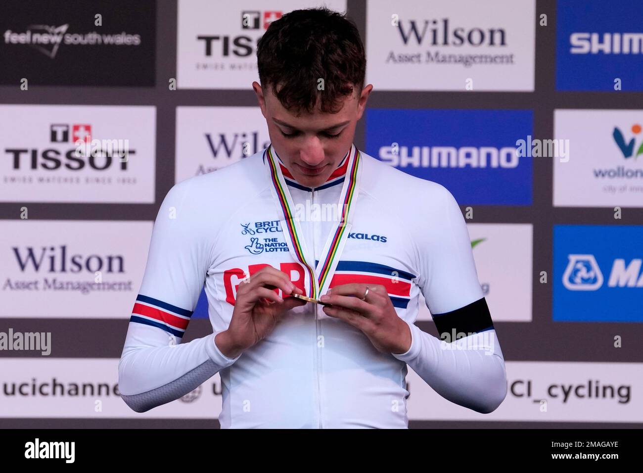 Britain's Leo Hayter looks at his bronze medal he won in the men's ...