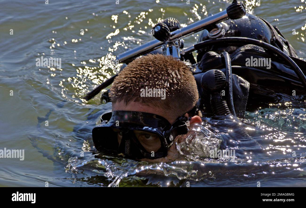 061002-N-9708H-015. [Complete] Scene Caption: U.S. Navy Utilitiesman ...