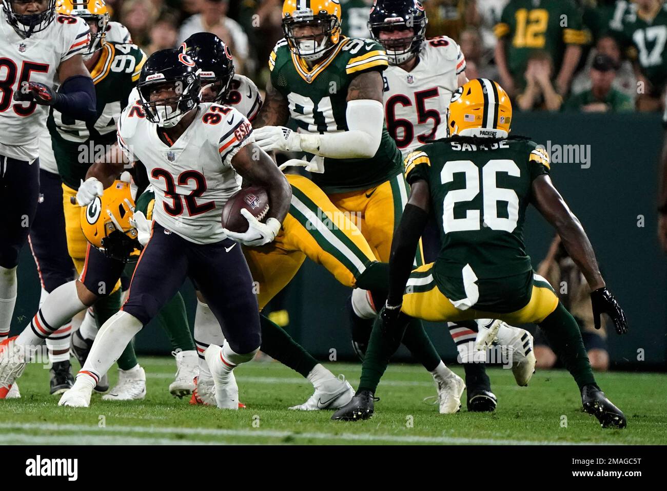 Chicago Bears running back David Montgomery (32) runs from Green Bay Packers safety Darnell ...