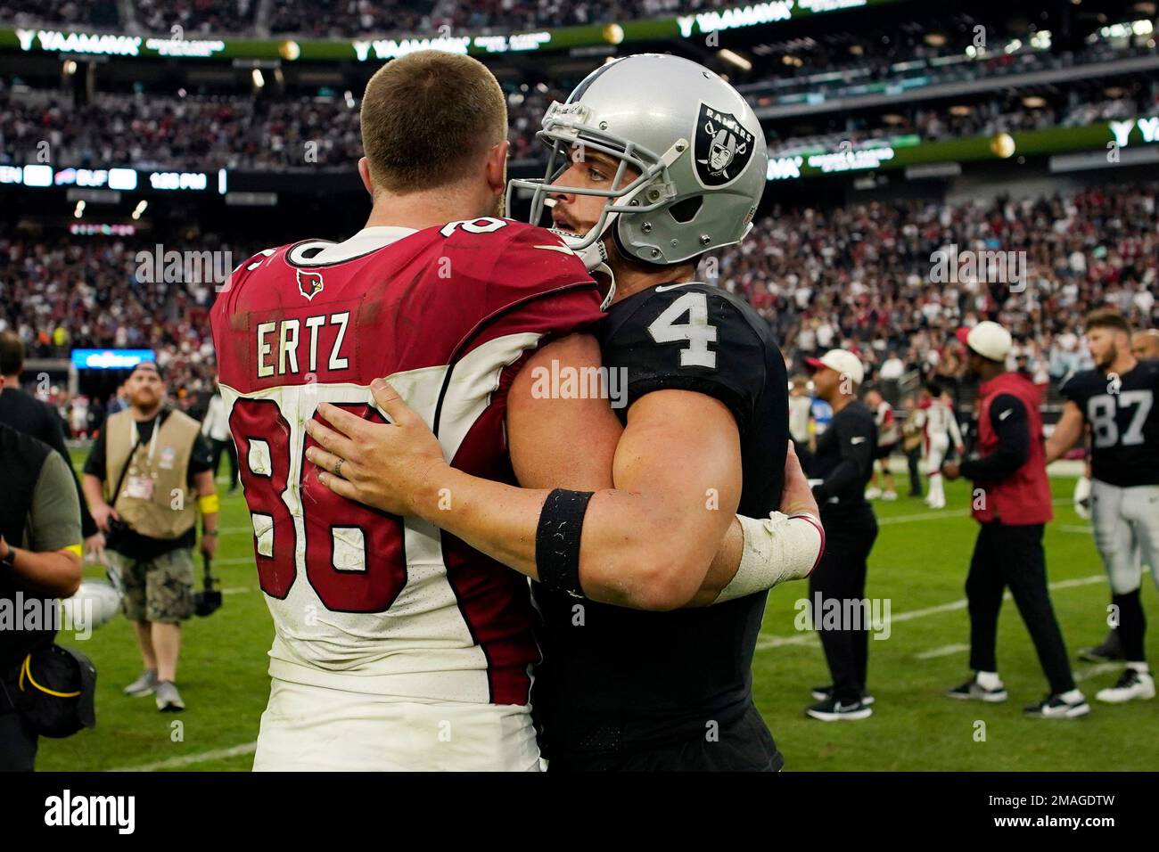 Las Vegas Raiders quarterback Derek Carr, right, hugs Arizona Cardinals ...