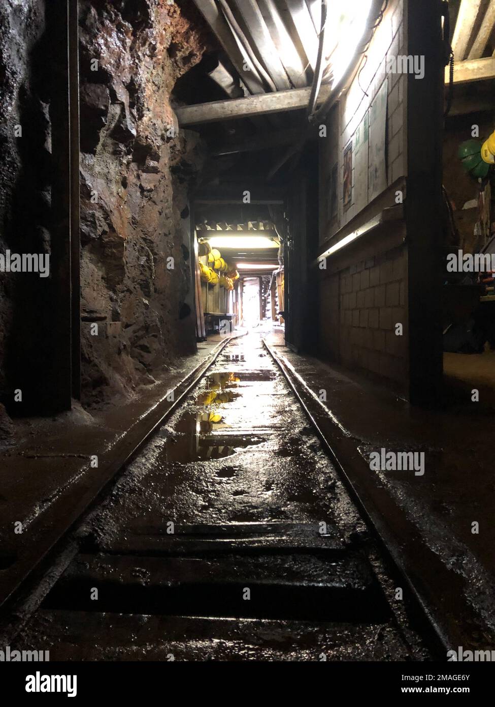 An inside view of the underground tunnel of coal mining with lights ...