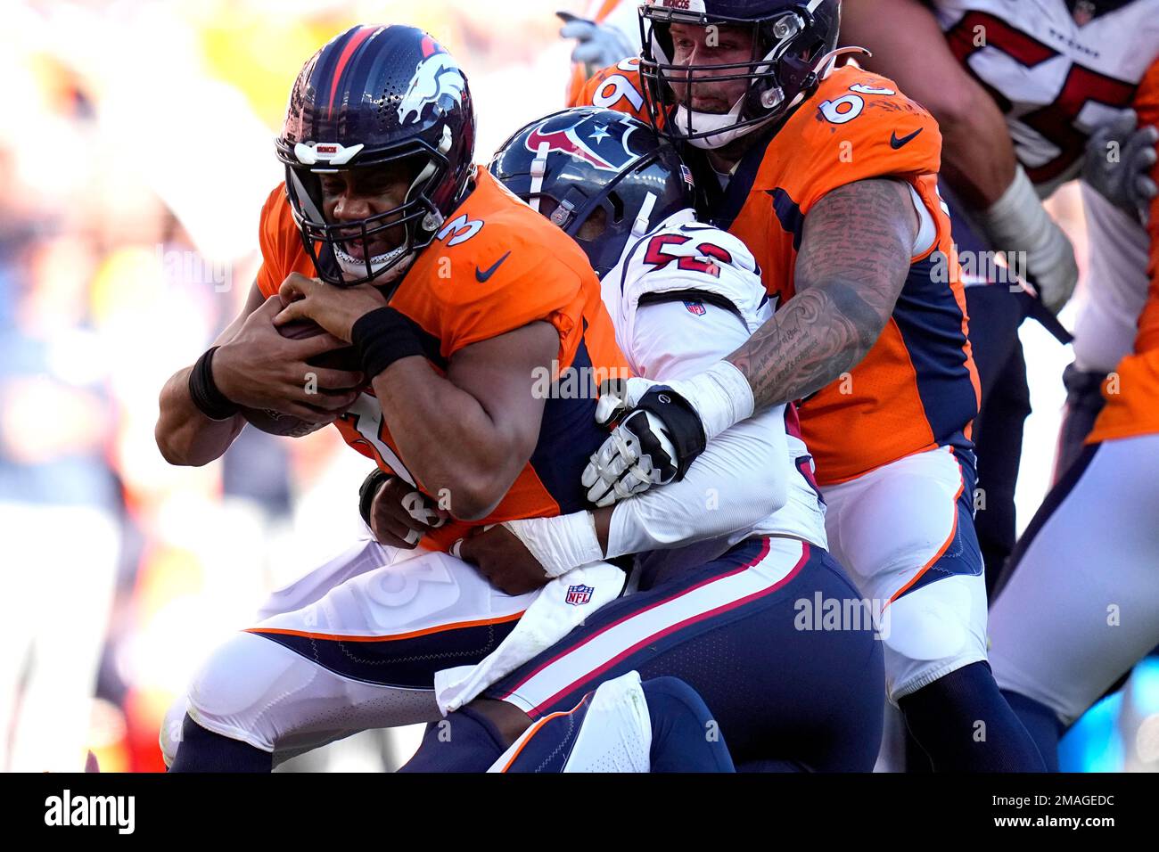 Denver Broncos quarterback Russell Wilson (3) his sacked by Houston ...