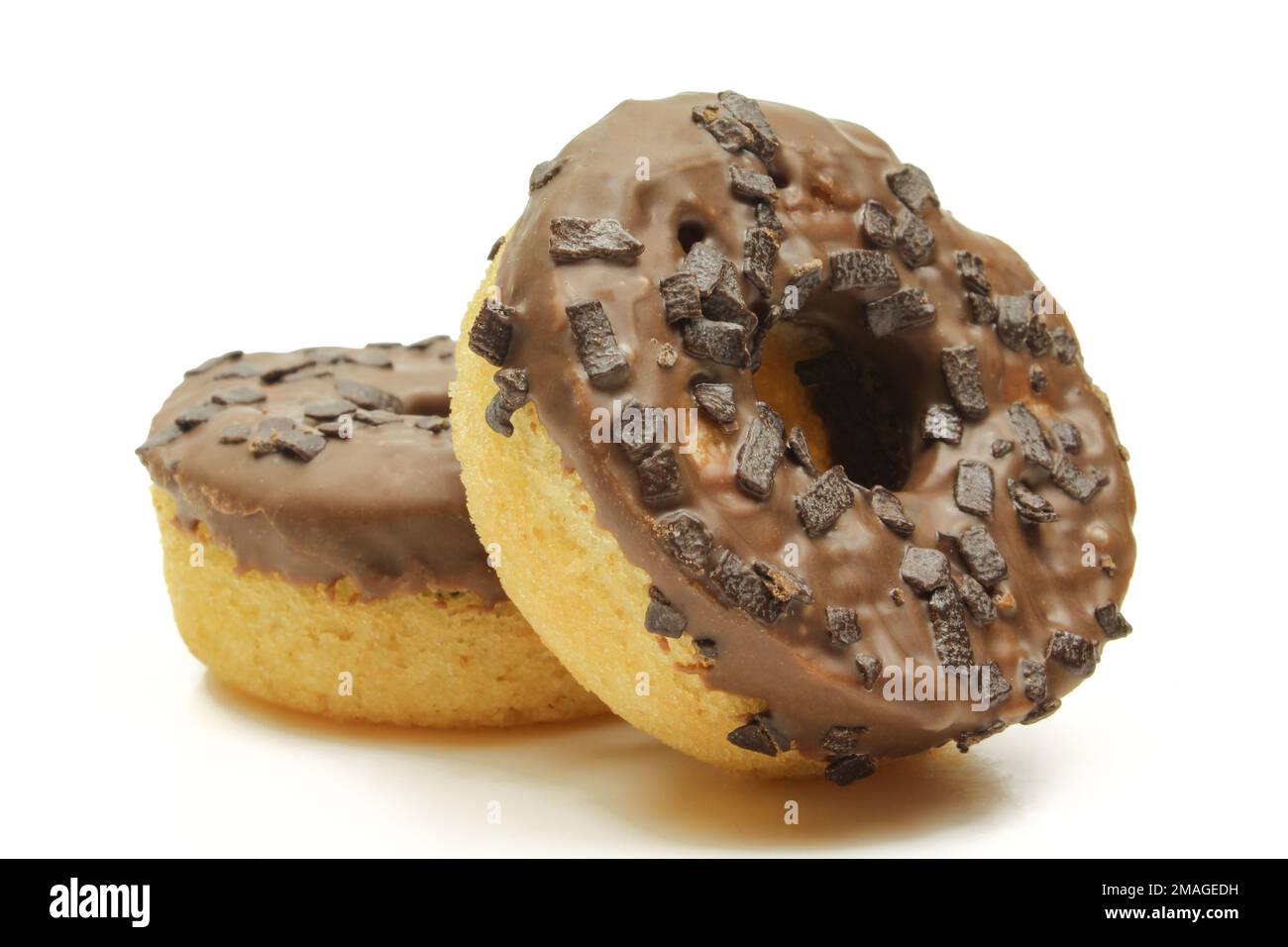 Two chocolate glazed donuts with chocolate sprinkles icing Stock Photo ...