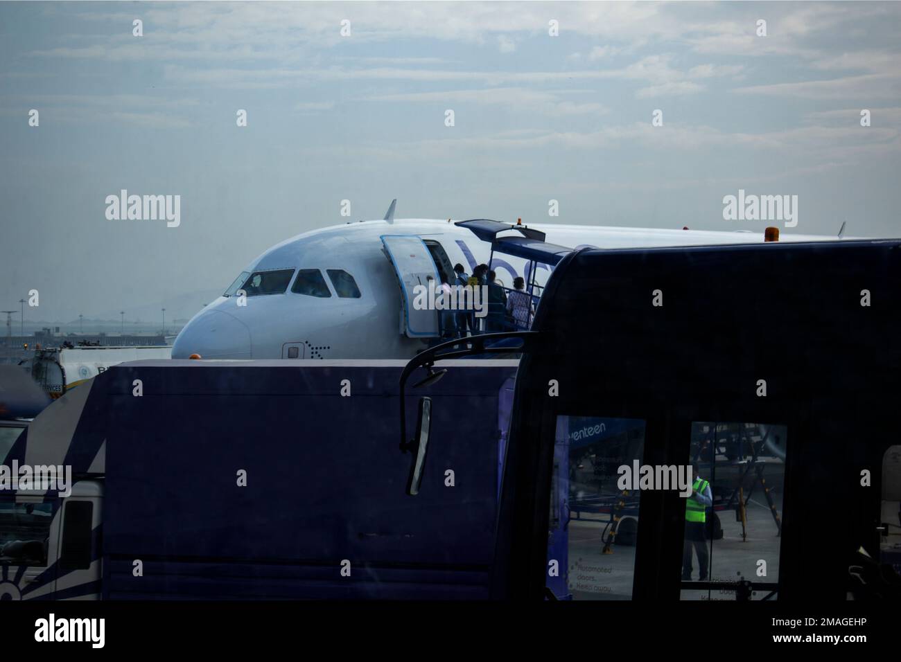 Indian aircraft landed in a busy airport terminal engine wings close ...