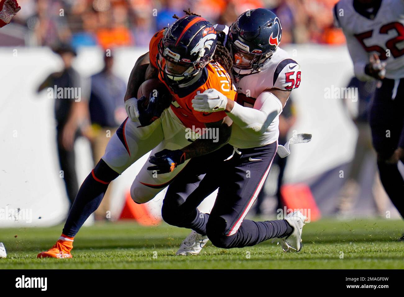 Denver Broncos wide receiver Tyrie Cleveland is tackled by Houston ... Denver Broncos wide receiver Tyrie Cleveland is tackled by Houston ...