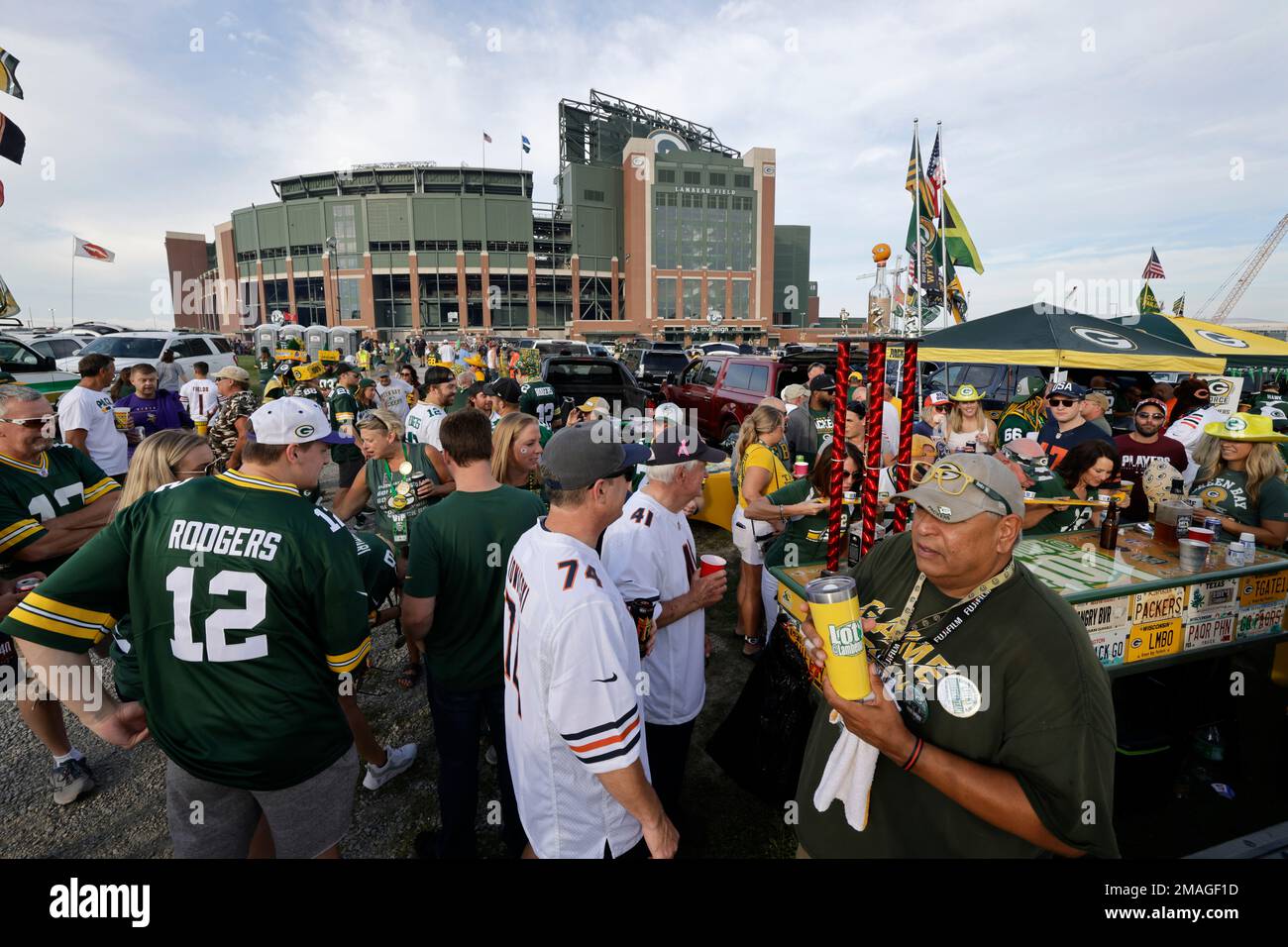 Fans tailgate outside Lambeau Field before an NFL football game between ...