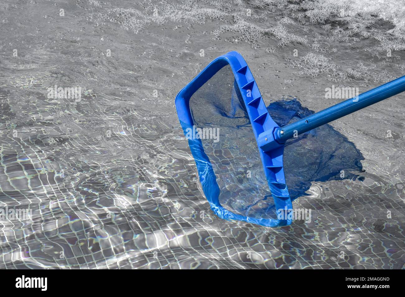 Mesh net for cleaning pool from debris. Cleaning pool, city fountain ...