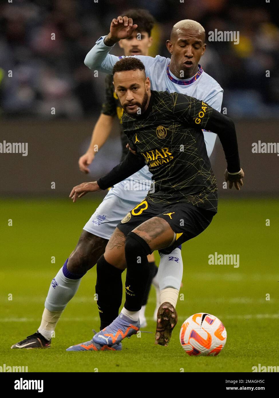 PSG's Neymar challenges for the ball with Saudi Season Team's Talisca ...
