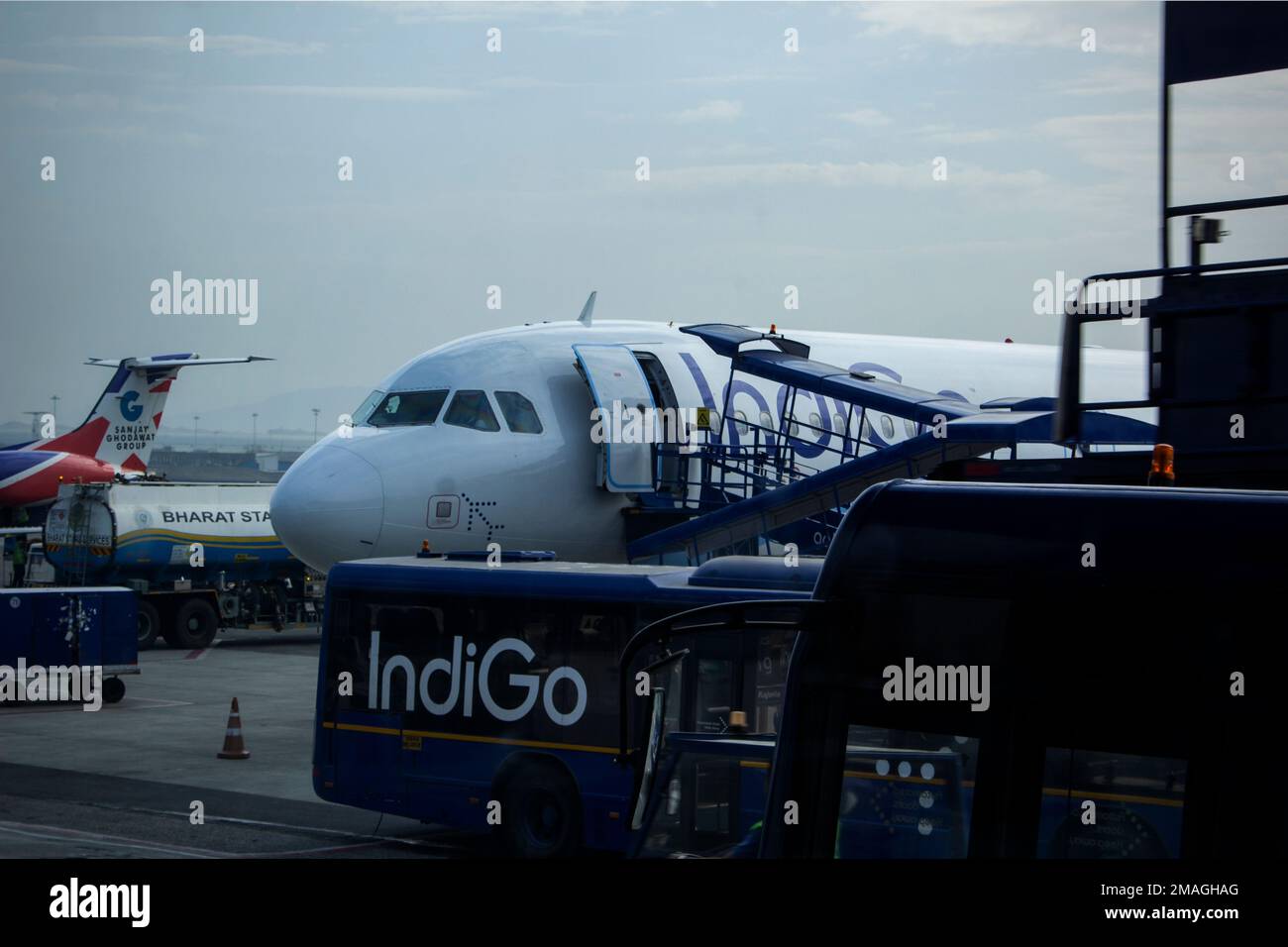 Indian aircraft landed in a busy airport terminal engine wings close ...