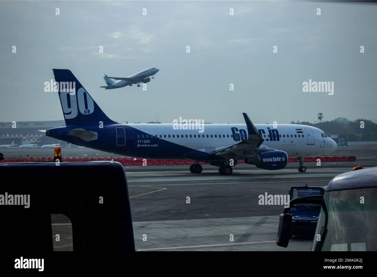 Indian aircraft landed in a busy airport terminal engine wings close ...