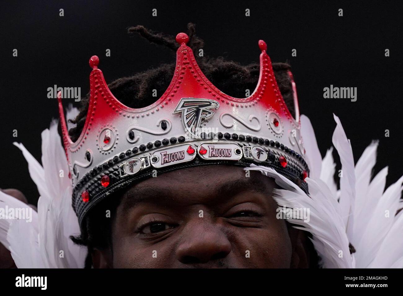 An Atlanta Falcons fan looks on before an NFL football game against the ...