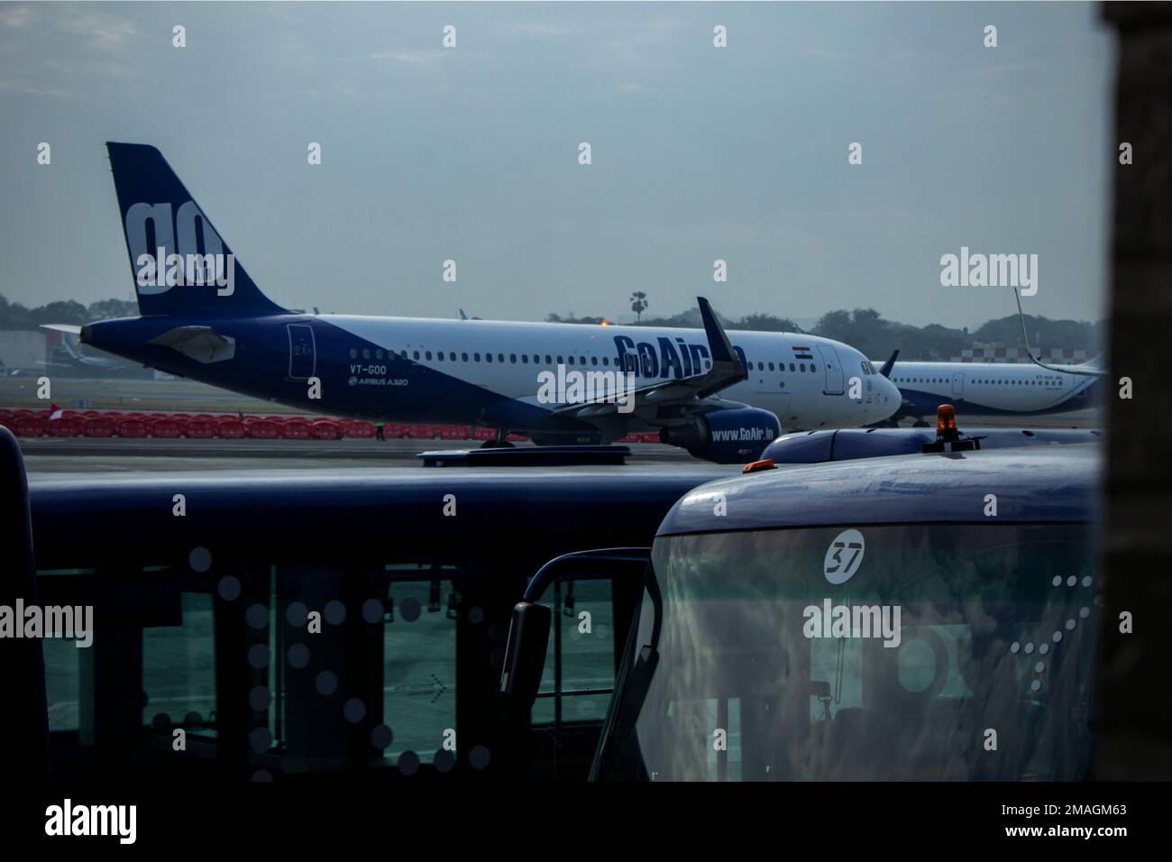 Indian aircraft landed in a busy airport terminal engine wings close ...