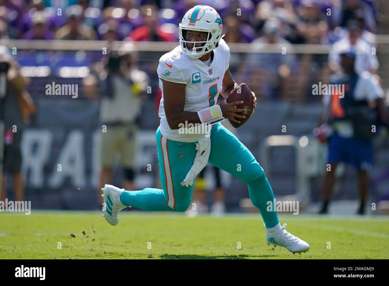 Miami Dolphins quarterback Tua Tagovailoa (1) looks to throw a pass during the first half of an ...