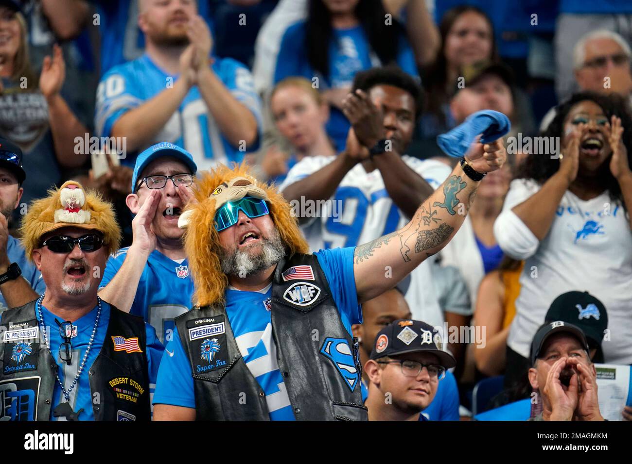 Detroit Lions fans cheer during the first half of an NFL football game ...