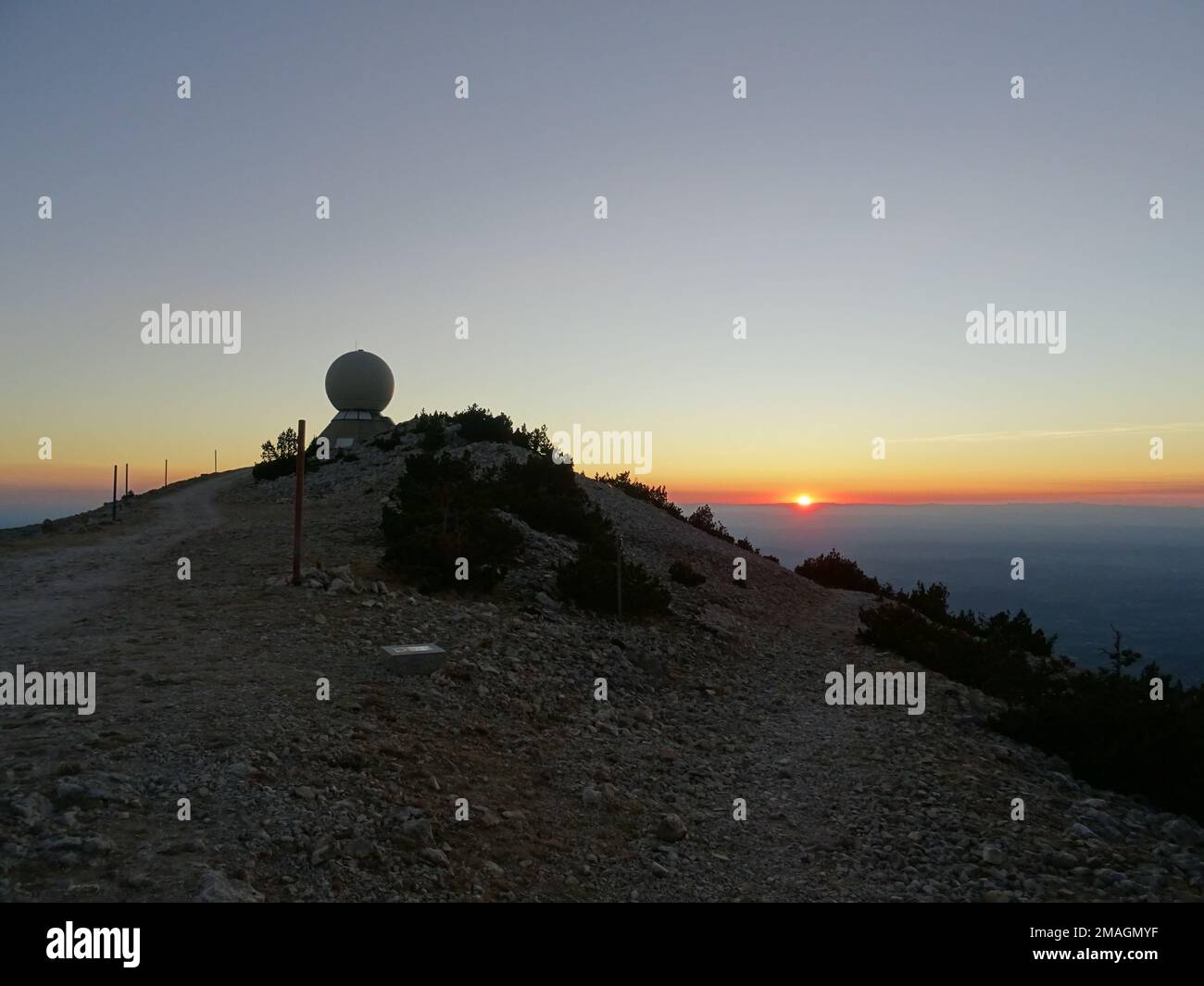 A beautiful sunset over a hill Stock Photo - Alamy