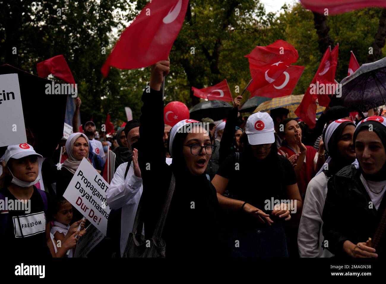 Turkish demonstrators chant slogans while holding Turkish flags during ...