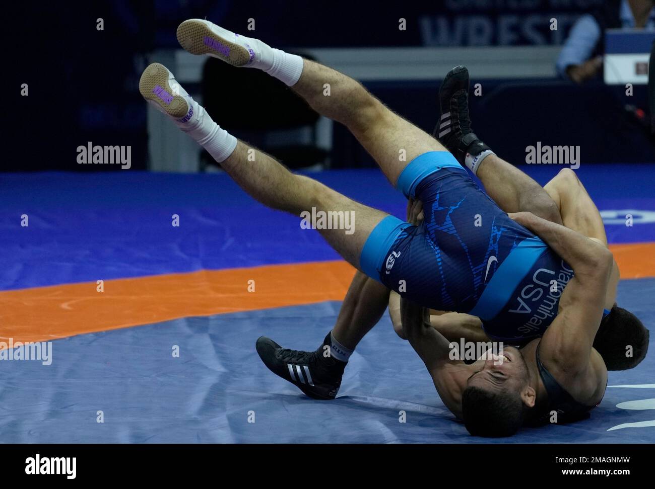 Iran's Rahman Mousa Amouzadkhalili, down, and John Michael Diakomihalis ...