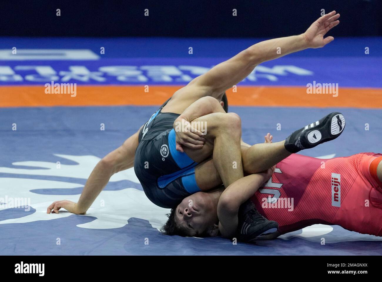 Japan's Rei Higuchi, right, and Iran's Reza Ahmadali Atrinagharchi ...