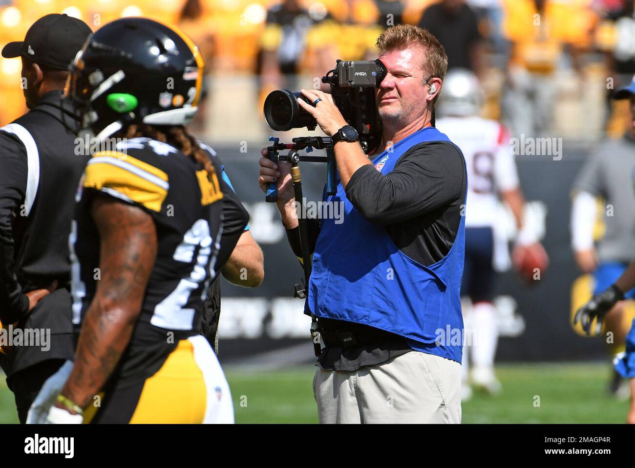NFL Films cameraman Kevin Simkins works an NFL football game between ...