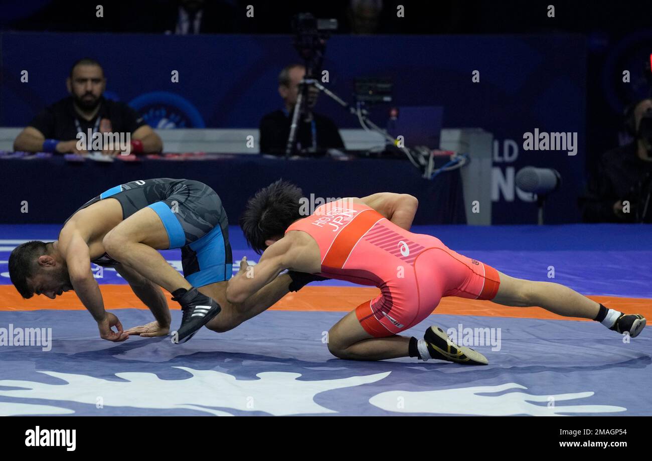 Japan's Rei Higuchi, right, and Iran's Reza Ahmadali Atrinagharchi ...