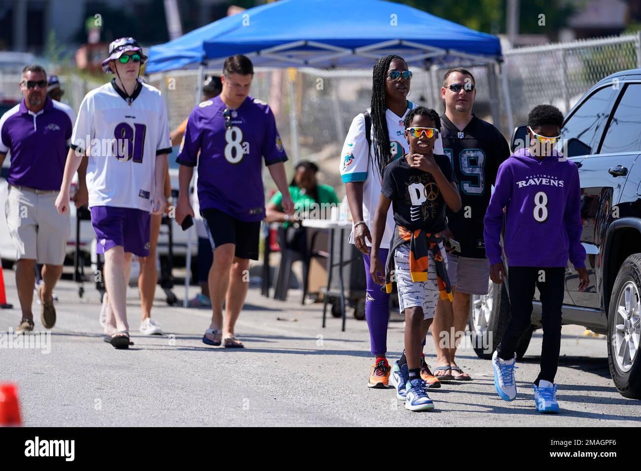 Baltimore Ravens fans arrive for an NFL football game against the Miami ...