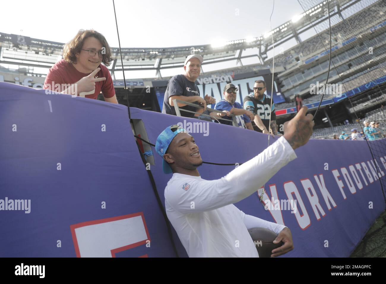 Carolina Panthers' DJ Moore takes pictures with fans before an NFL ...
