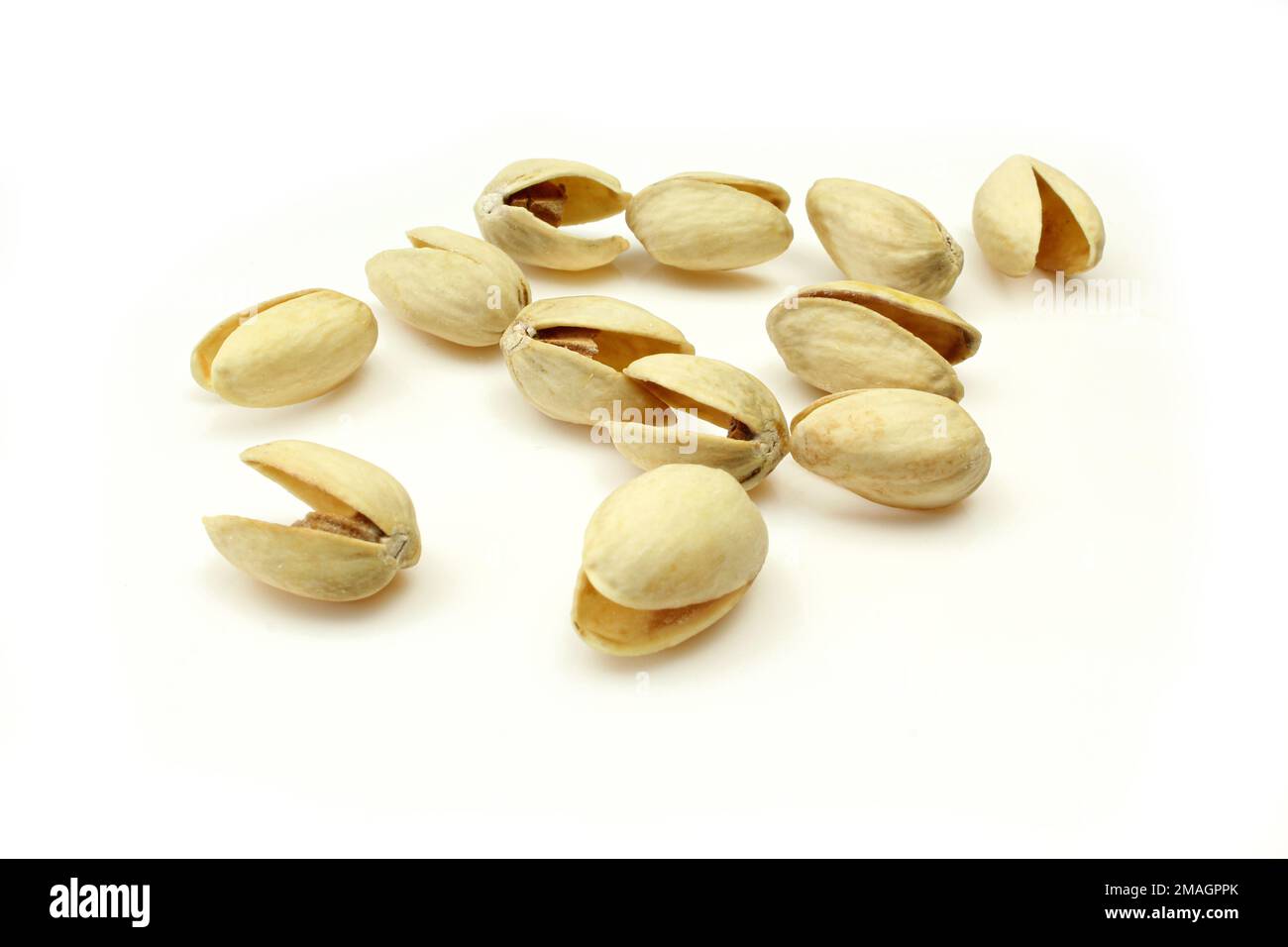 Empty pistachio shells isolated on white background Stock Photo - Alamy