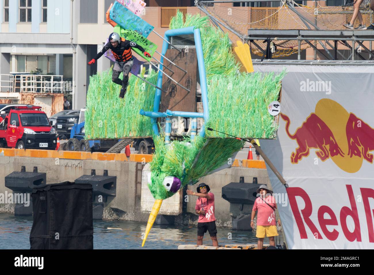 A team member jumps from a platform with a man made flying machine into ...