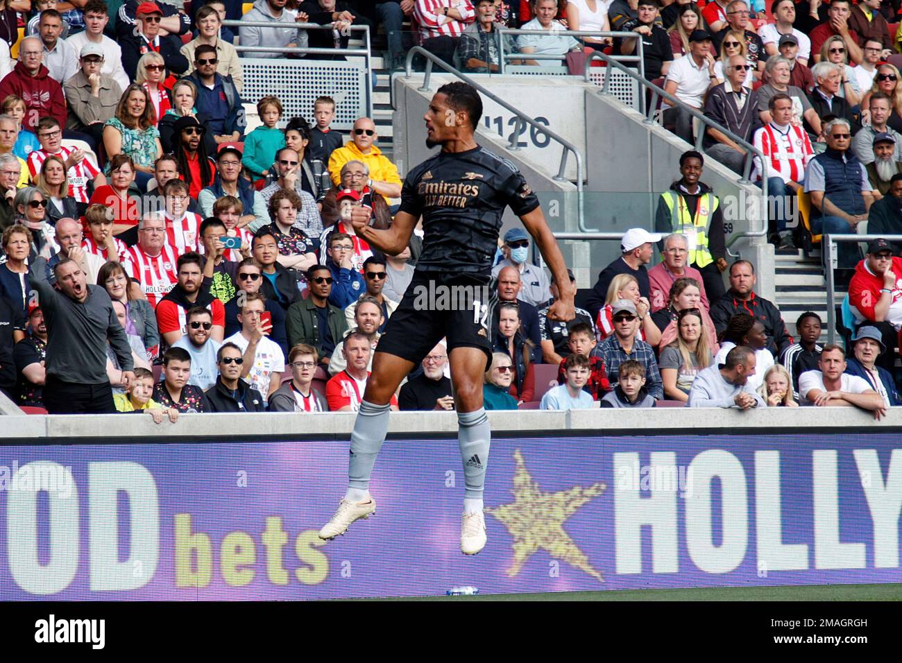 Arsenal's William Saliba celebrates after scoring his side's first goal ...