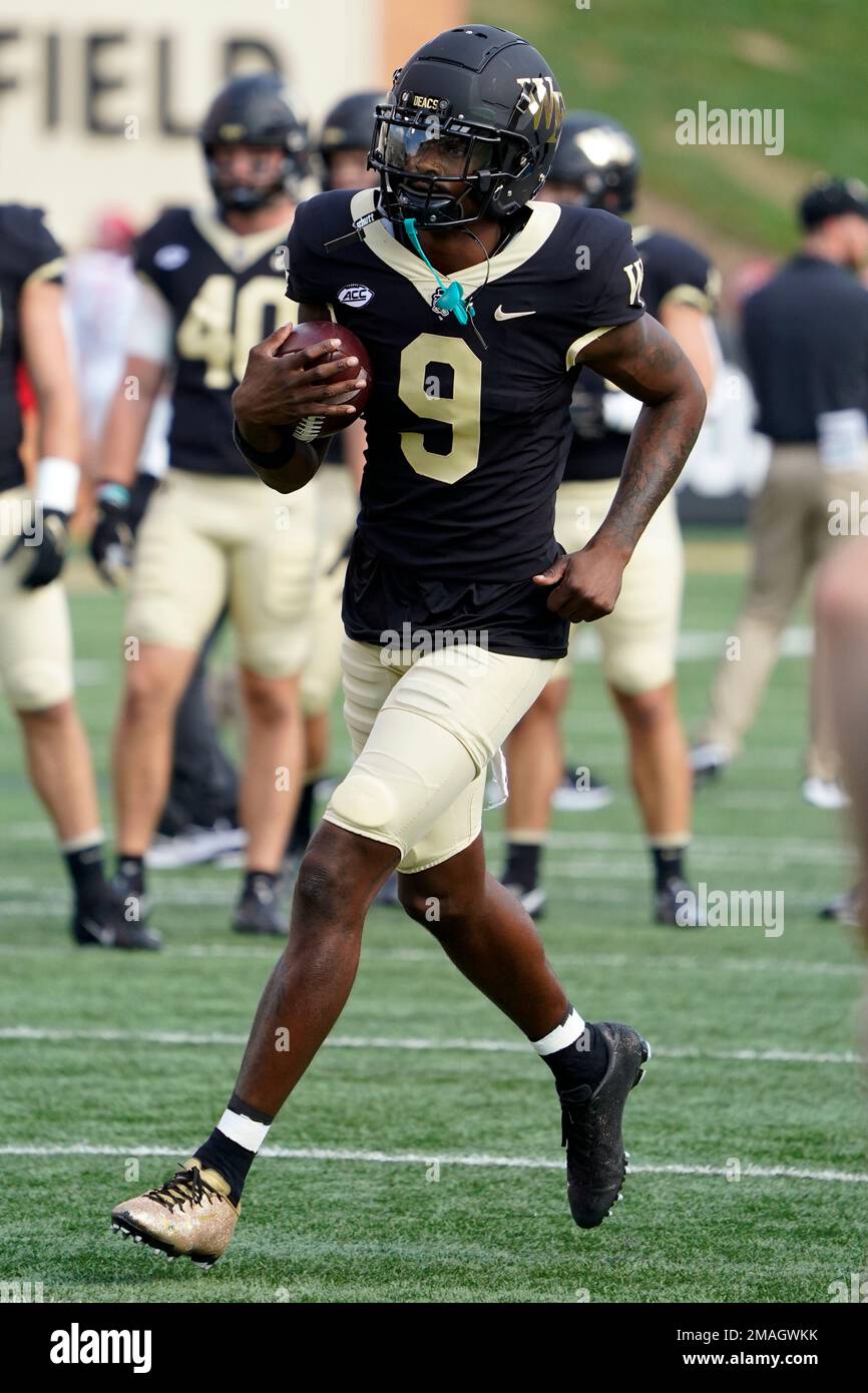 Wake Forest wide receiver A.T. Perry (9) warms up before an NCAA ...