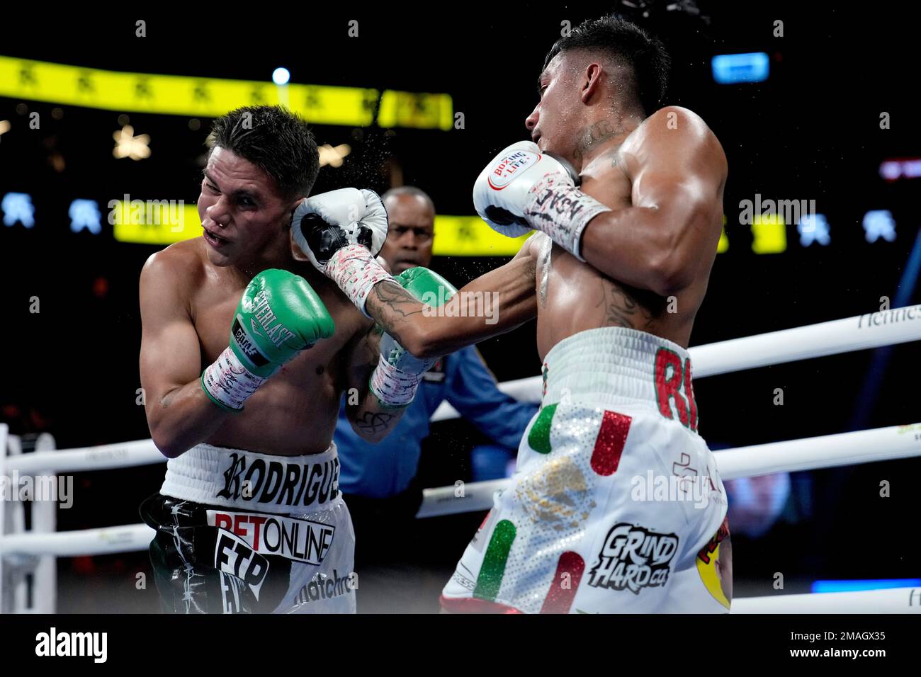 Jesse Rodriguez, left, fights Israel Gonzalez in a super flyweight ...