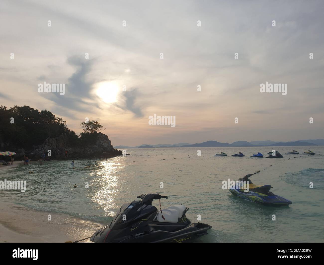 The empty jet skis in the sea under colorful cloudy sunset sky Stock ...