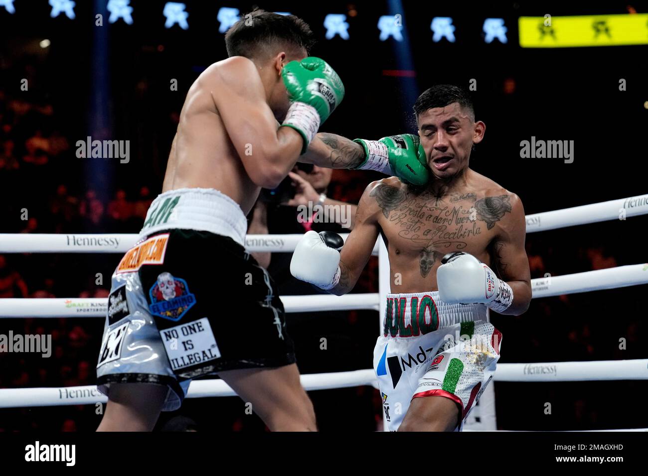 Jesse Rodriguez, left, fights Israel Gonzalez in a super flyweight ...