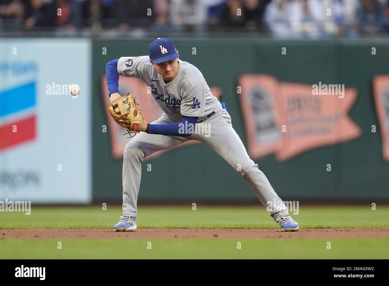 Los Angeles Dodgers shortstop Trea Turner makes an error on a grounder hit into by San Francisco ...