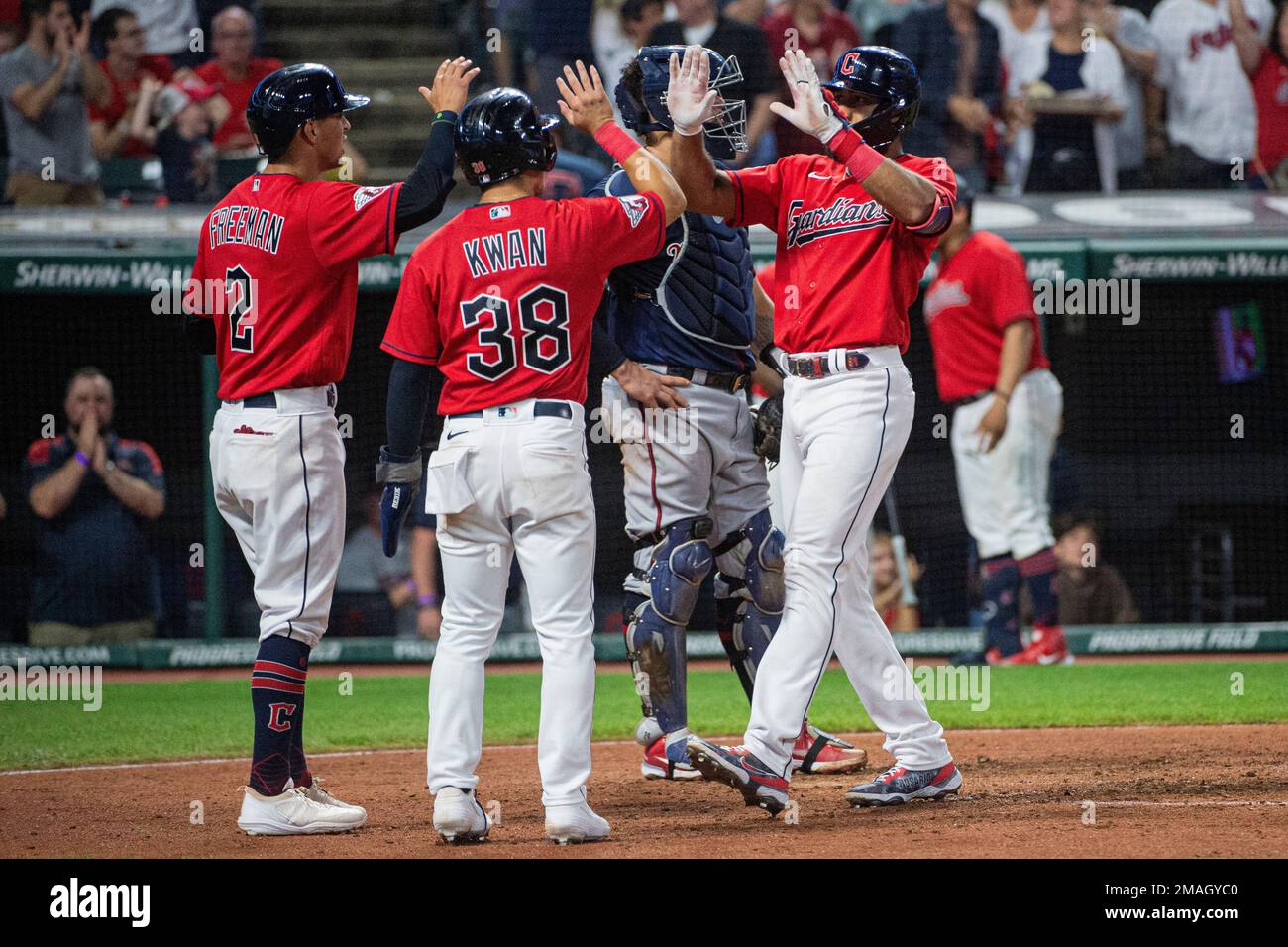 Cleveland Guardians' Amed Rosario is greeted at home plate by Steven ...