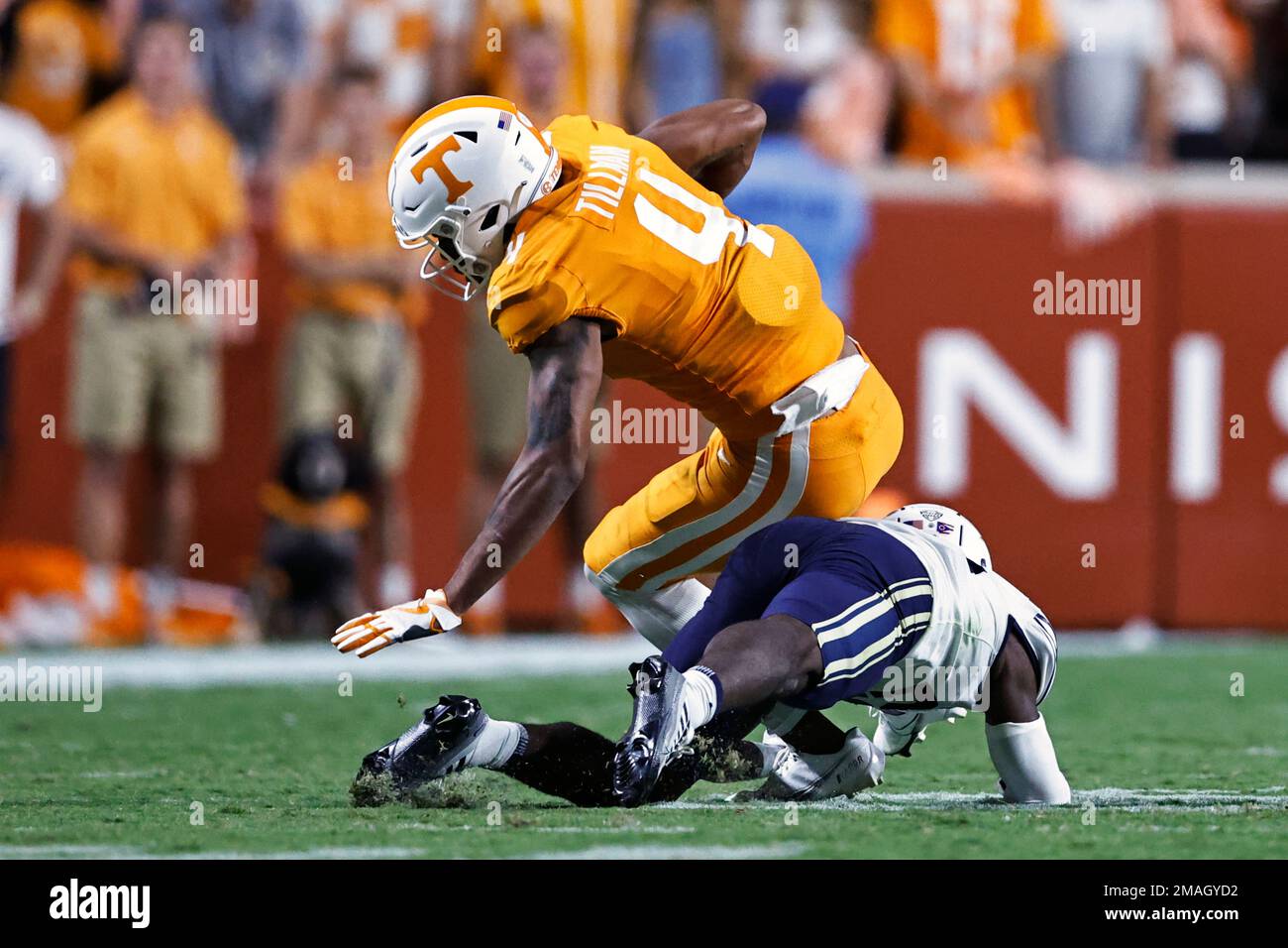 Tennessee wide receiver Cedric Tillman (4) is hit by Akron cornerback ...