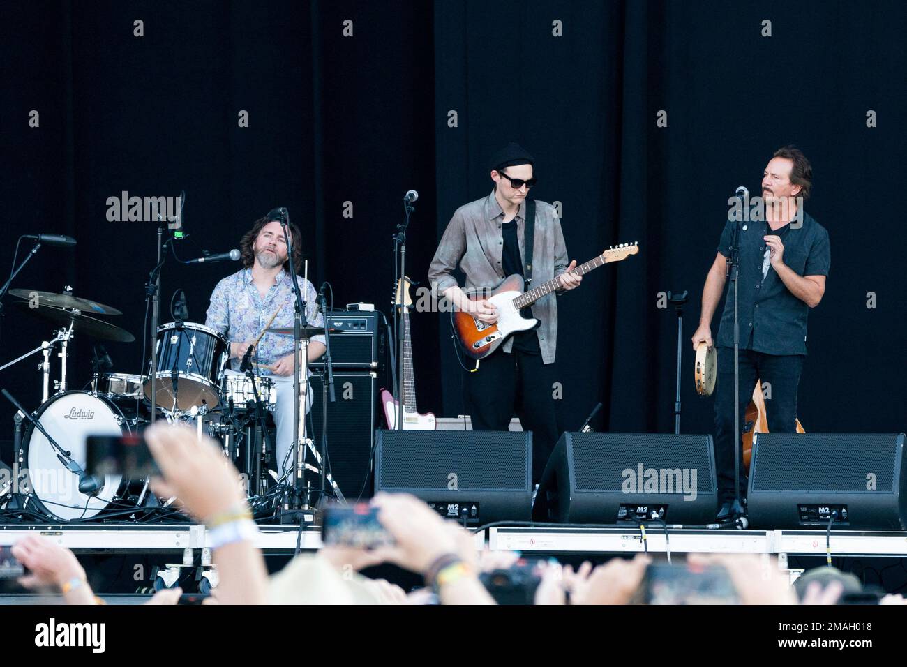 Liam Finn, left, of Crowded House, Josh Klinghoffer, and Eddie Vedder ...