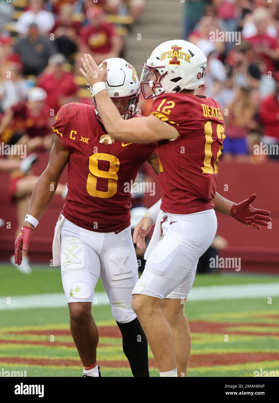 Iowa State wide receiver Xavier Hutchinson (8) is congratulated by Iowa ...