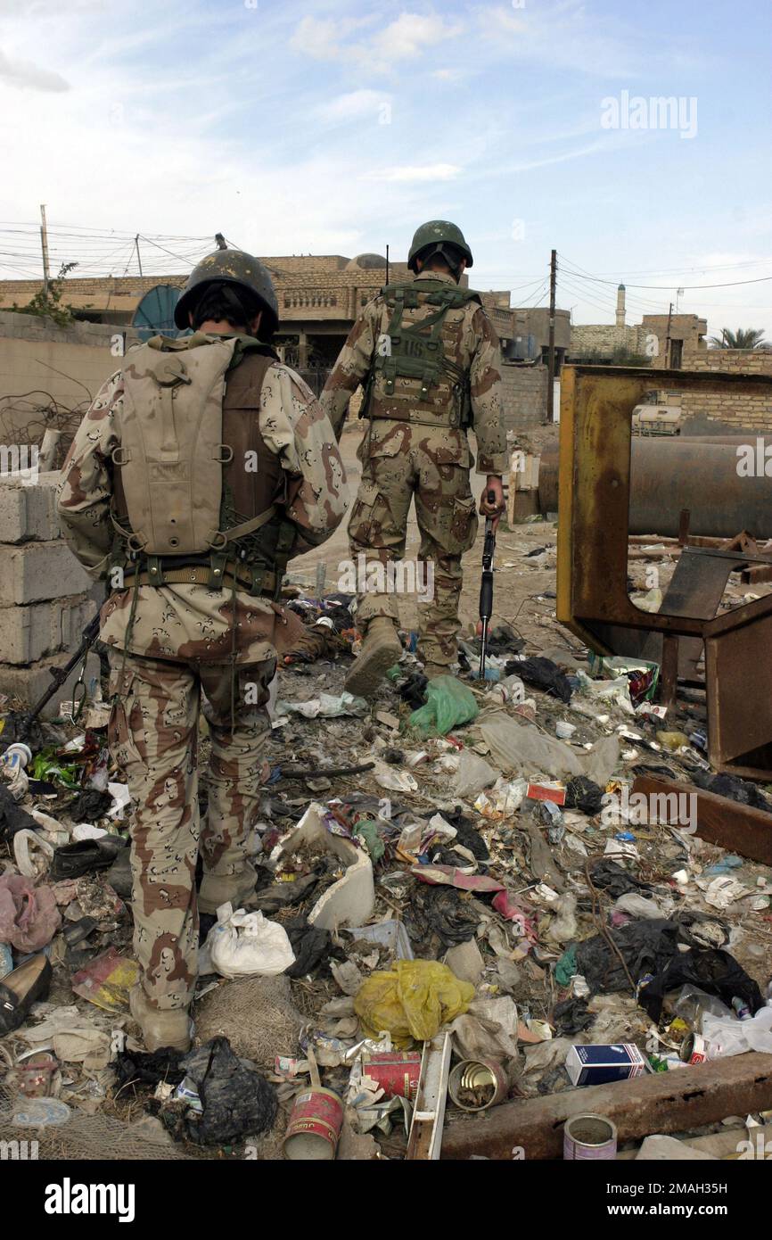 070317-M-2819S-005. [Complete] Scene Caption: Two soldiers with 2nd ...