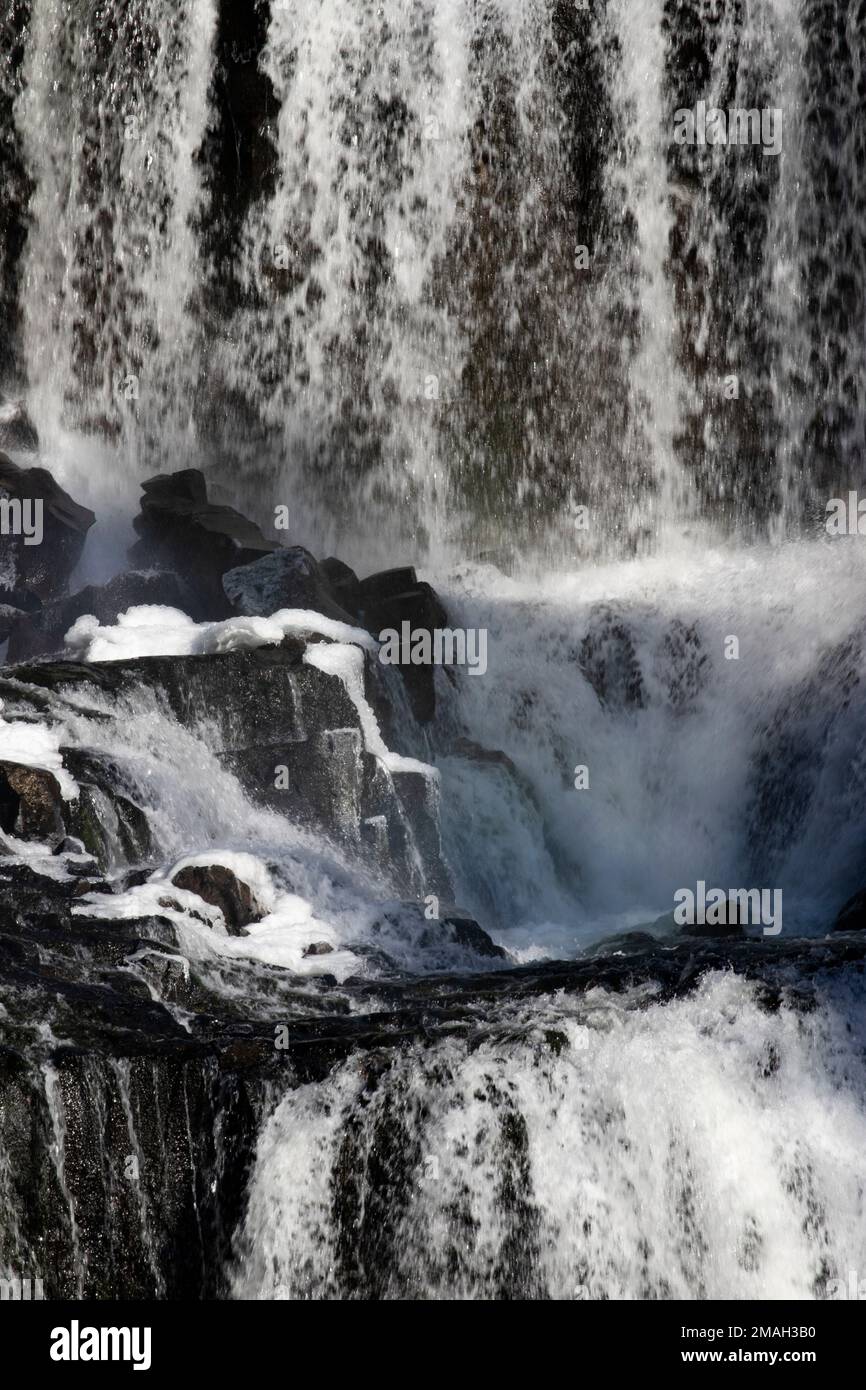 Cascading and falling water across rocks of Alexander Falls along Sea ...