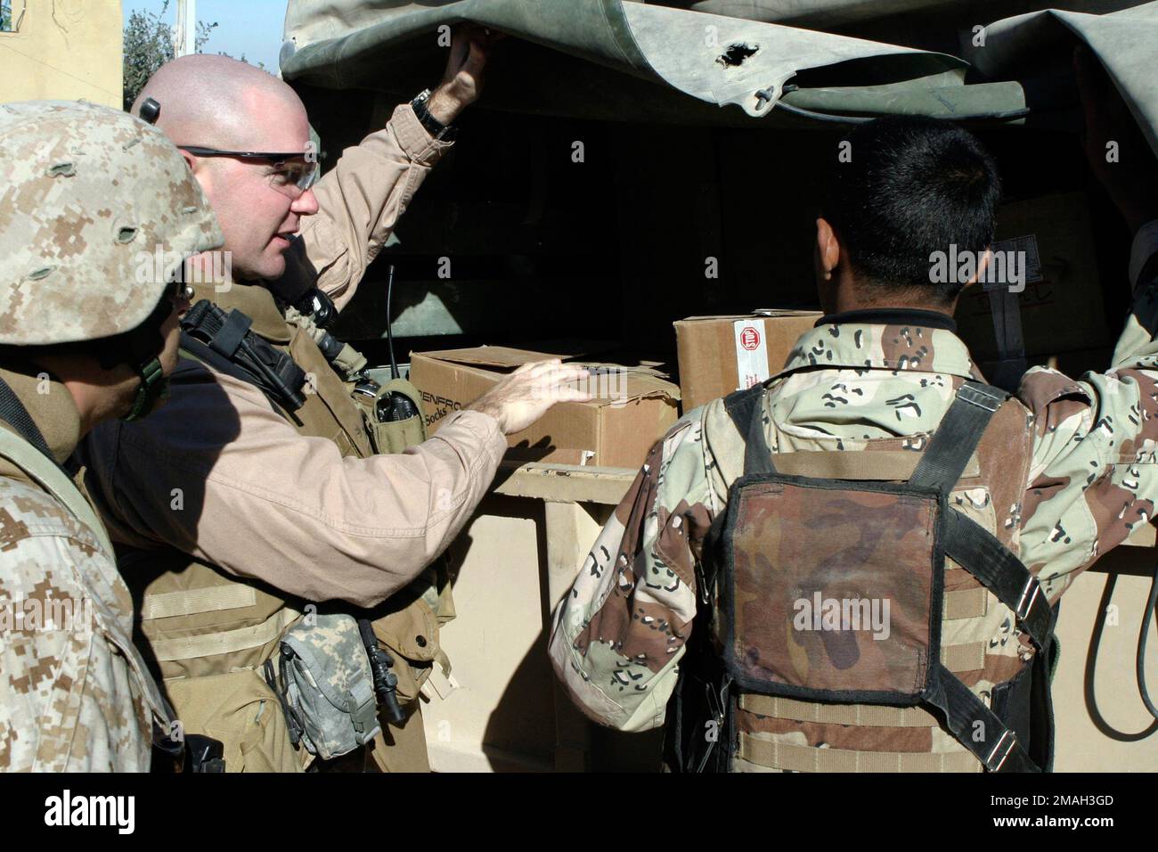 070318-M-2819S-005. [Complete] Scene Caption: MAJ. Helton with the ...