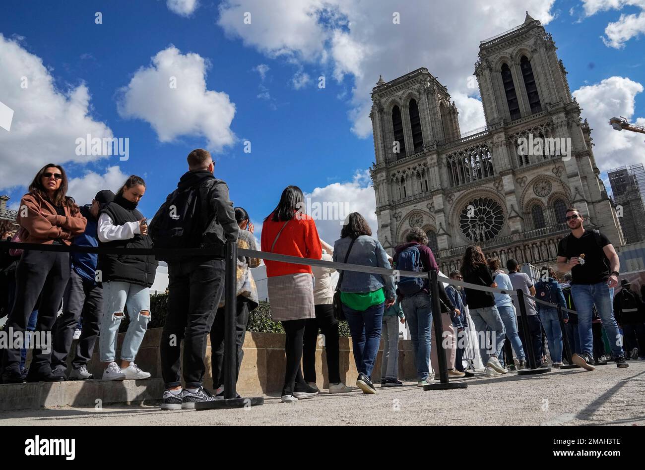 People lining up to have a close look of Notre Dame cathedral as they ...