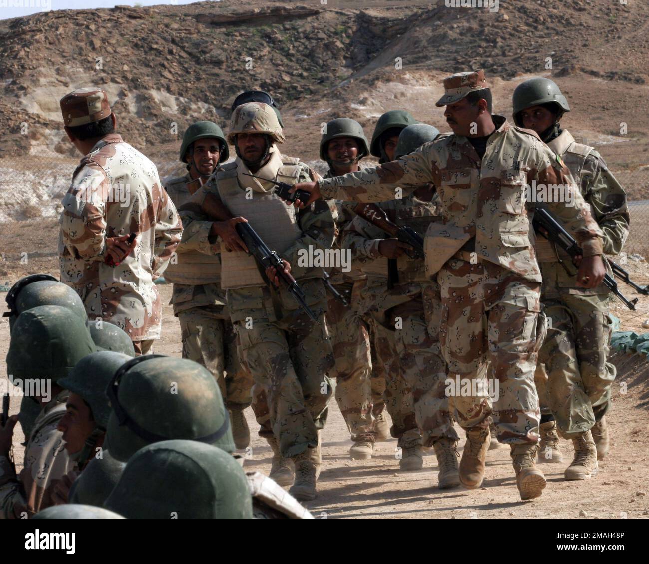 070320-M-7404B-011. [Complete] Scene Caption: An instructor with the ...