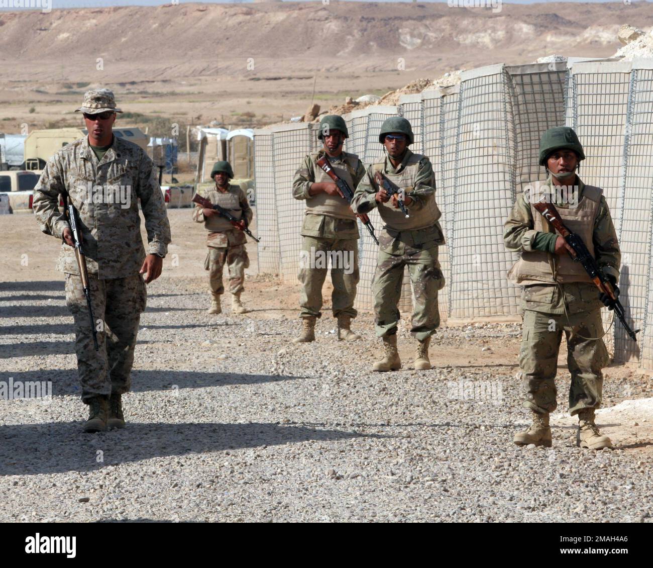 070320-M-7404B-014. [Complete] Scene Caption: STAFF SGT. Aslan Altan ...