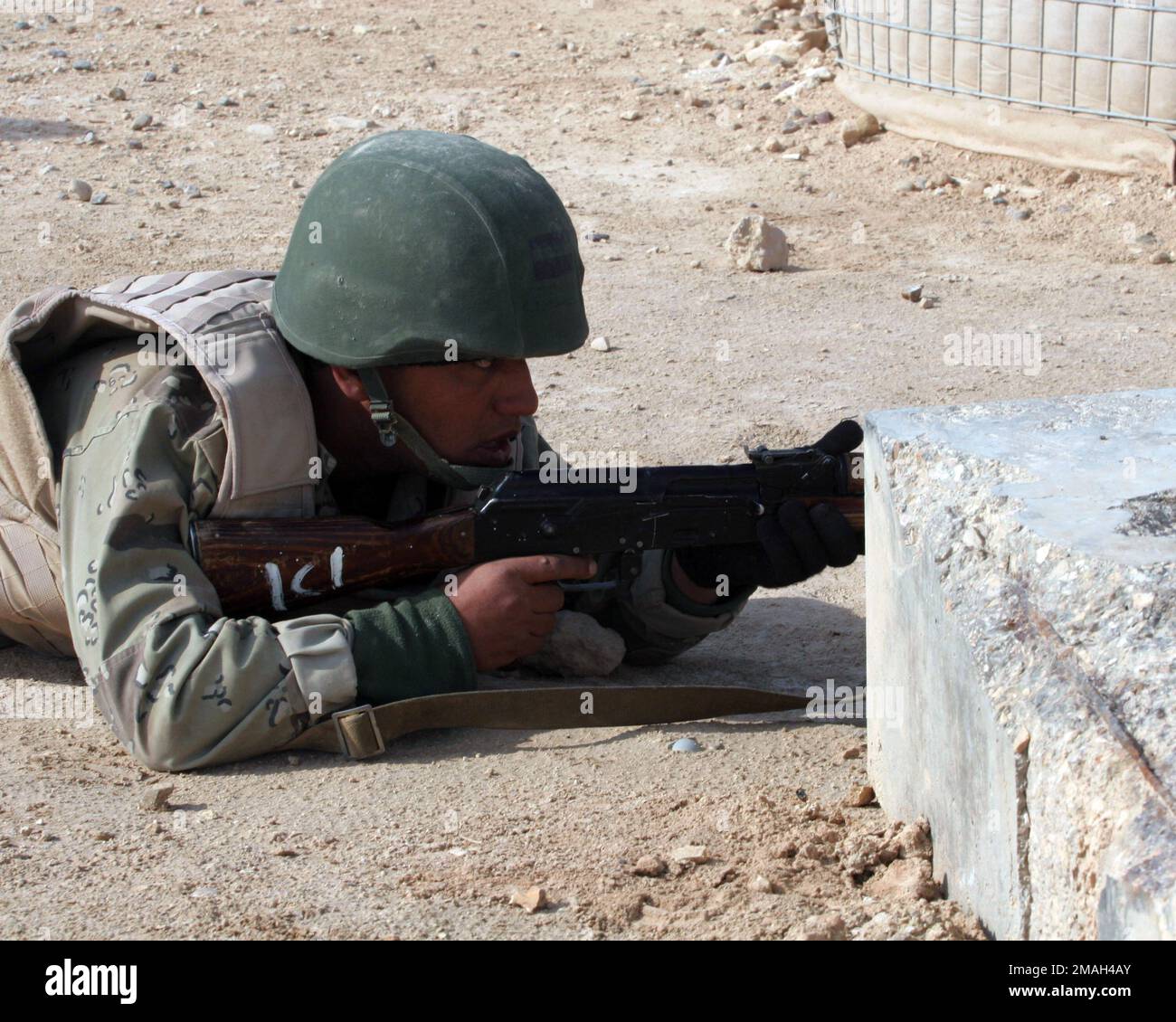 070320-M-7404B-015. [Complete] Scene Caption: An Iraqi Army Soldier in ...