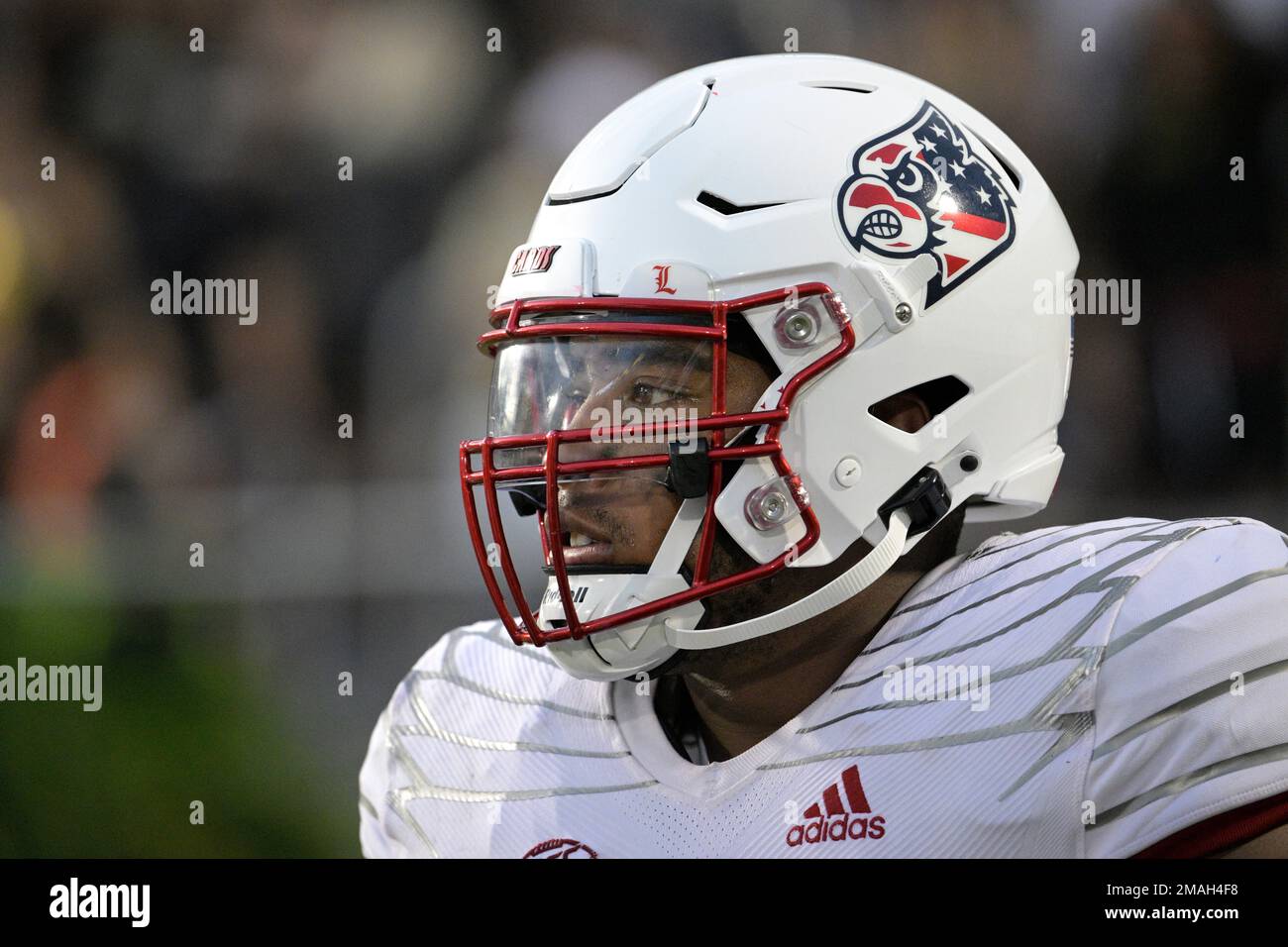 Louisville defensive back Kenderick Duncan (27) runs onto the field ...